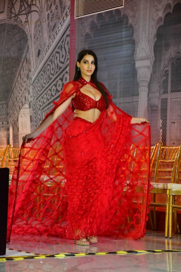 Nora Fatehi Mesmerizes in Fiery Red Saree at Jio World Plaza Launch