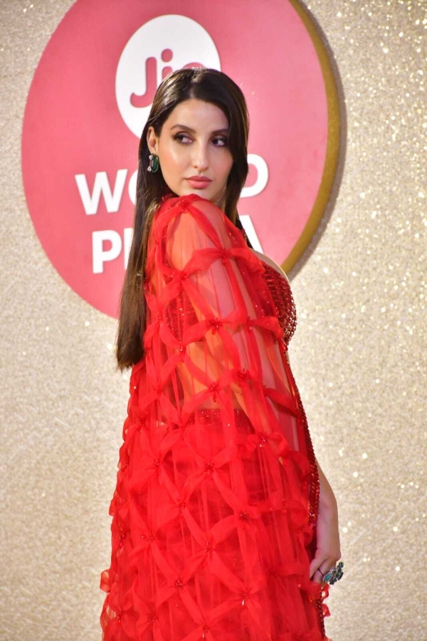 Nora Fatehi Mesmerizes in Fiery Red Saree at Jio World Plaza Launch